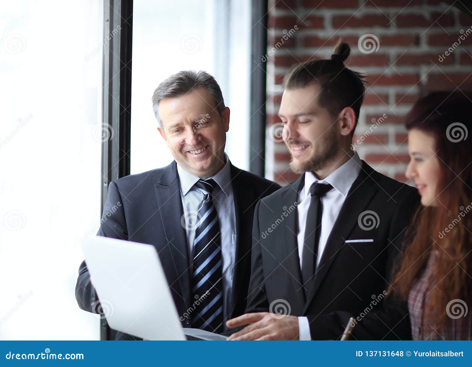Closeup.the Boss and Employees Look at the Laptop Screen Stock Photo ...