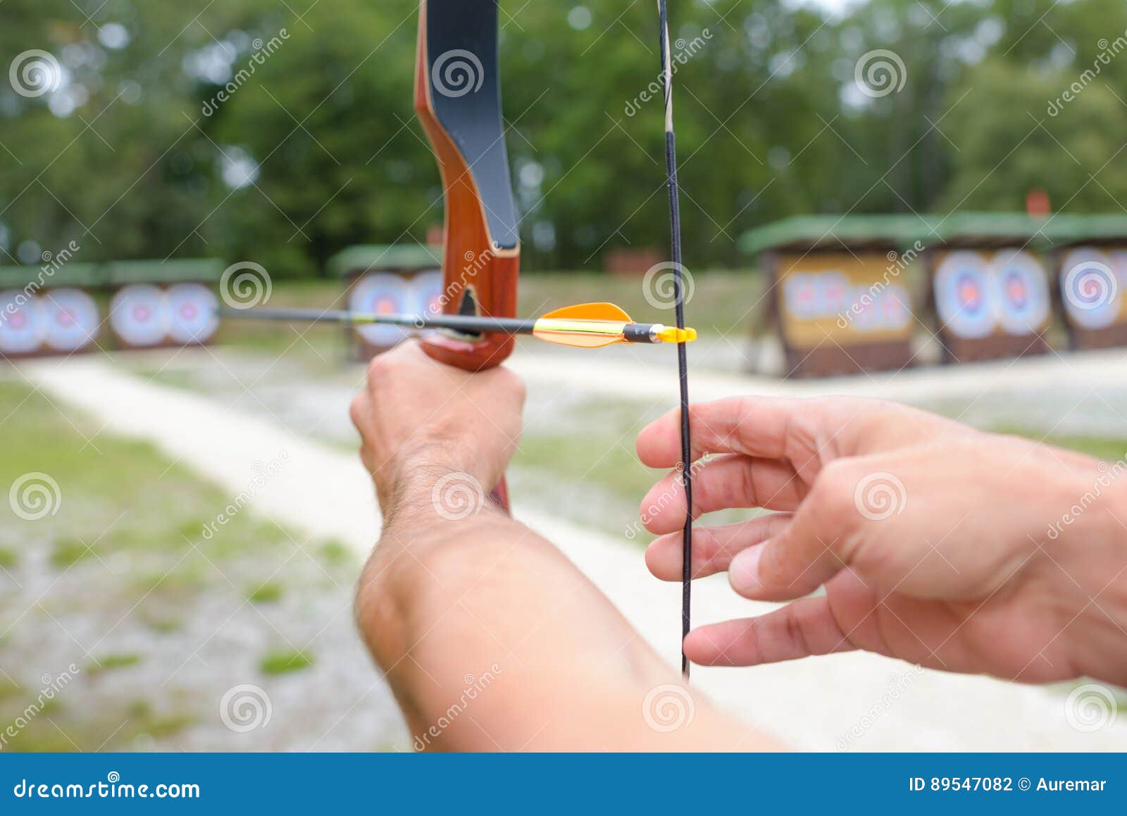 Closeup Bow and Arrow Being Aimed at Target Stock Photo - Image of taut ...