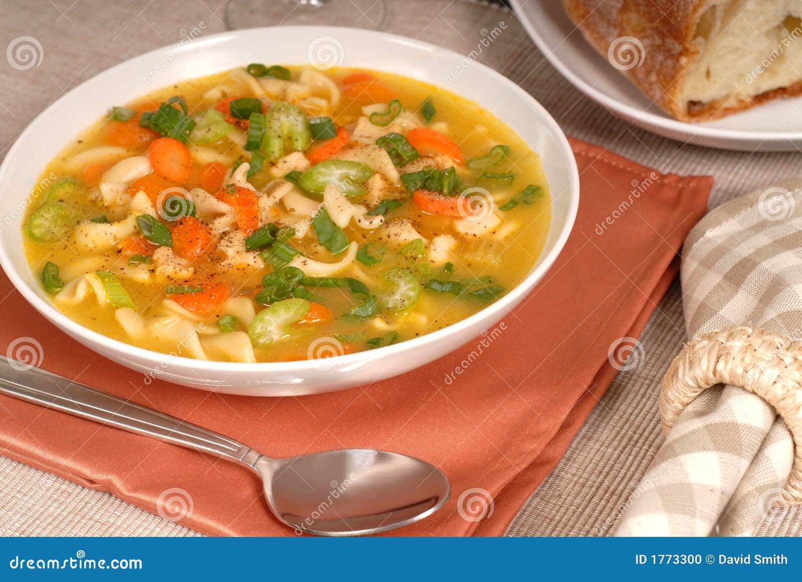 Closeup of a Bowl of Chicken Noodle Soup with Rustic Bread Stock Photo ...