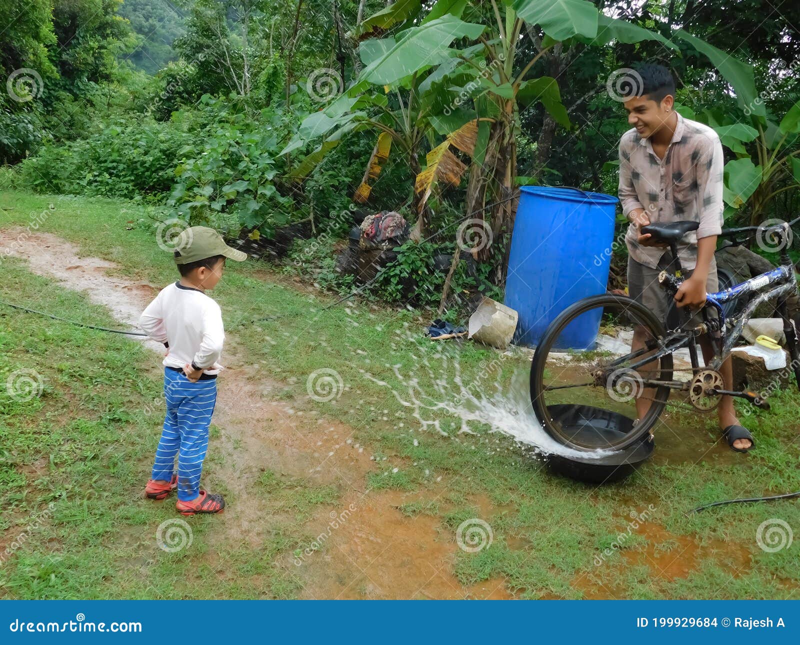 Closeup of a Boy with a Kid Enjoying with Water Drops Editorial Stock ...