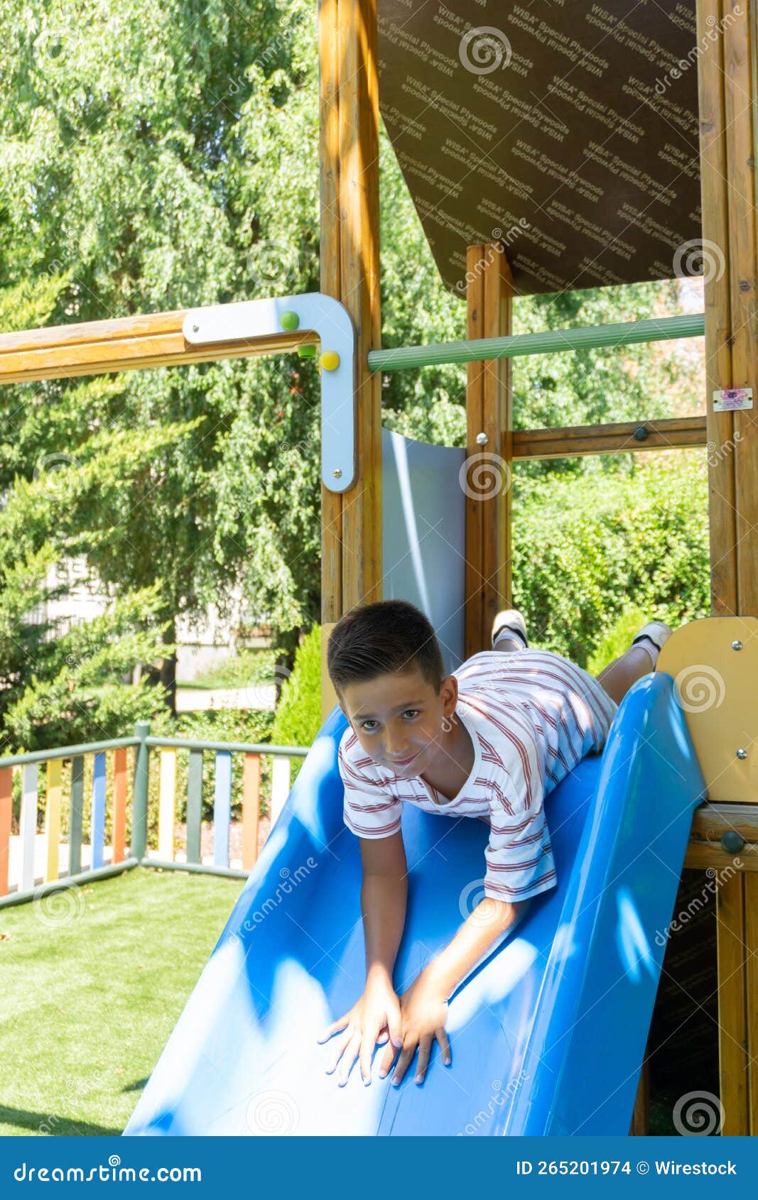 Closeup of a Boy Sliding on an Outdoor Playground Slide Stock Photo ...