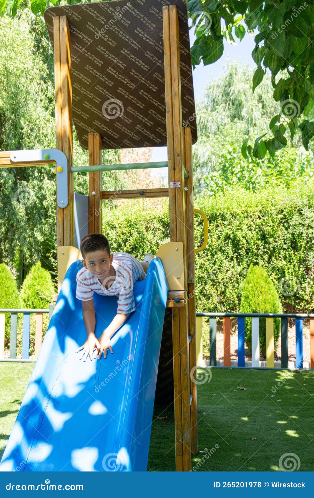 Closeup of a Boy Sliding on an Outdoor Playground Slide Stock Photo ...