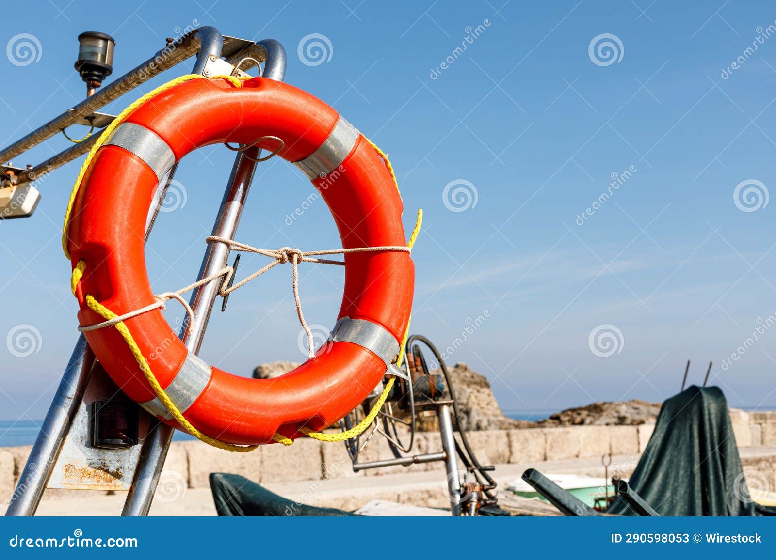 Closeup of a Bright Orange Life Preserver Visible Against the Backdrop ...