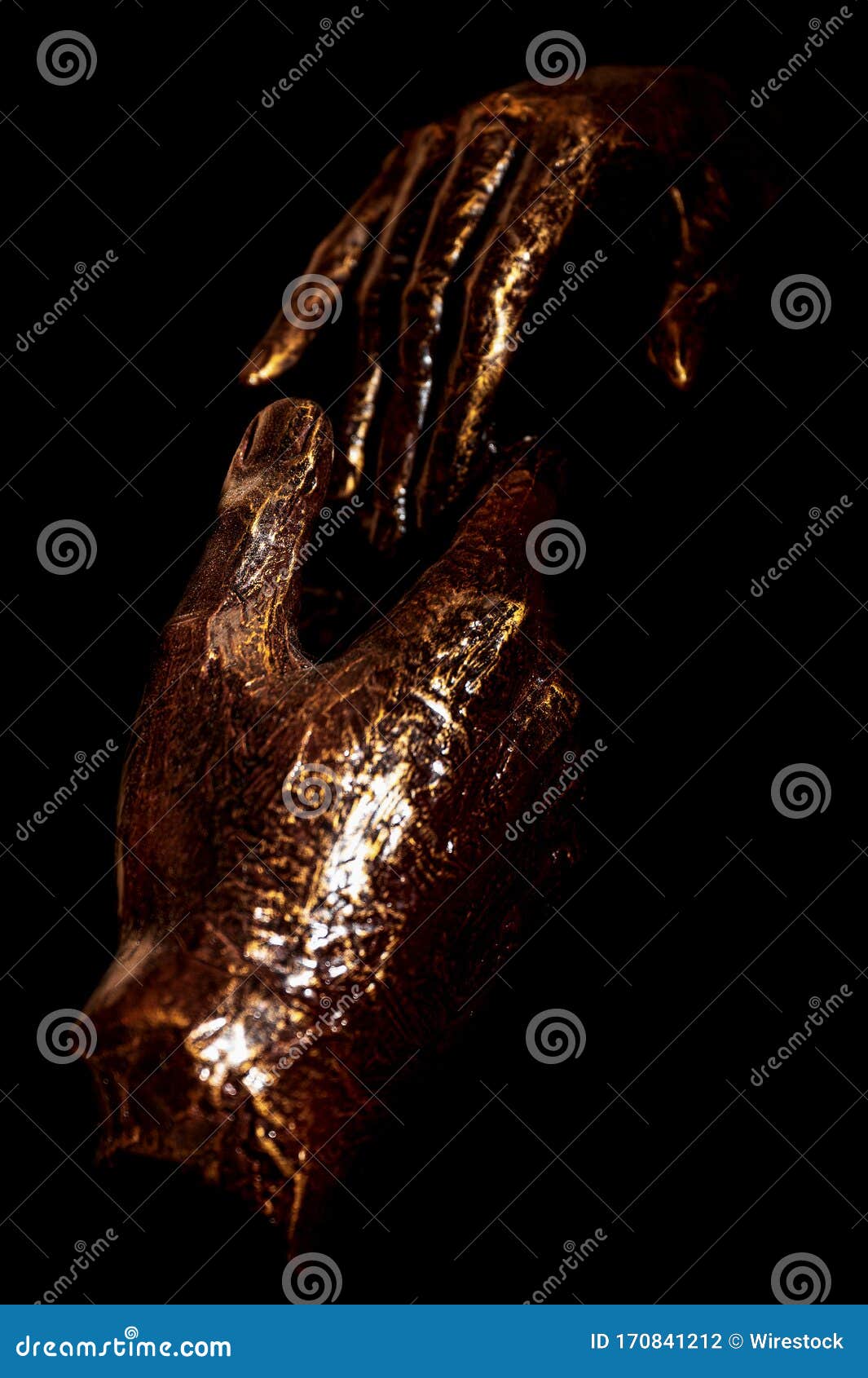Closeup of a Bronze Sculpture of Two Hands Holding Each Other Stock ...