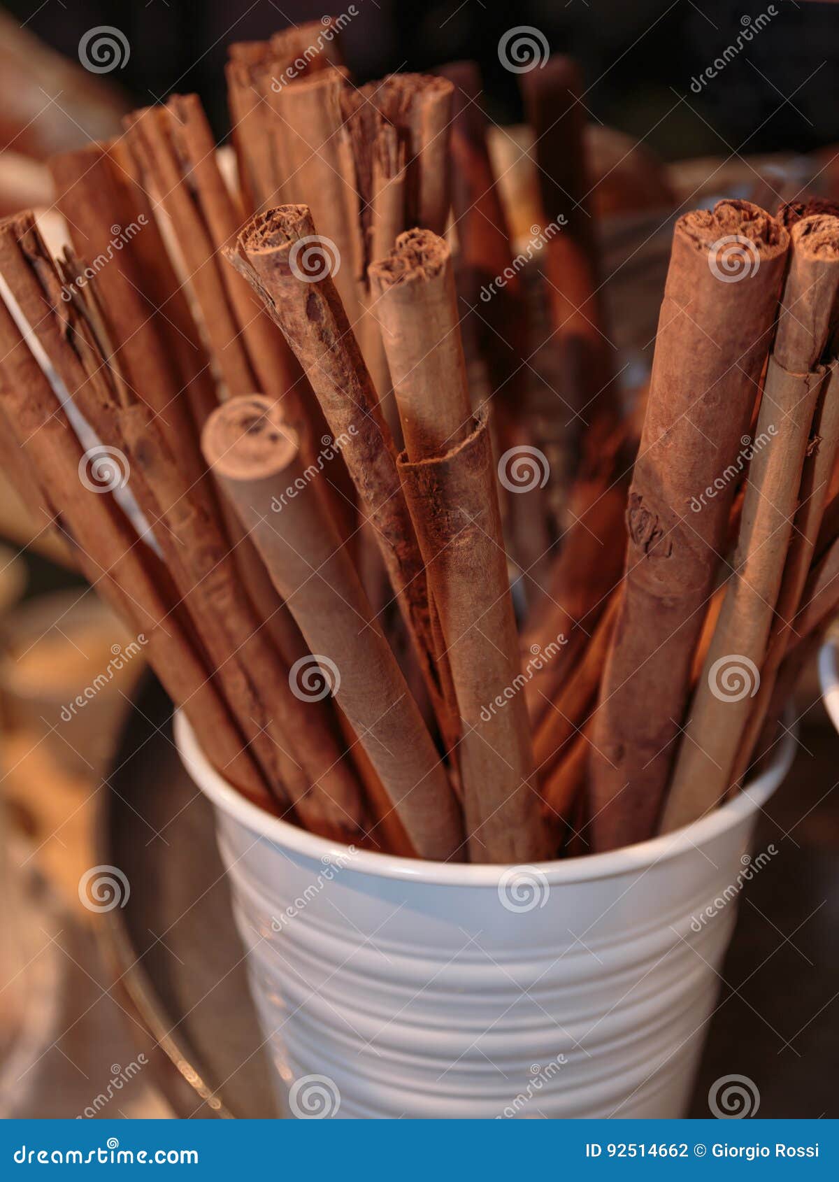 Closeup of Brown Cinnamon Sticks Inside White Container Stock Photo ...