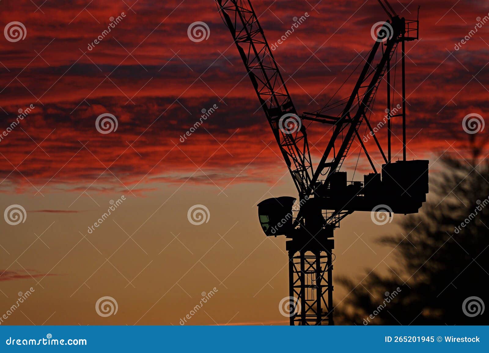 Closeup of a Built Crane in Maroon Color Clouds Background Stock Image ...