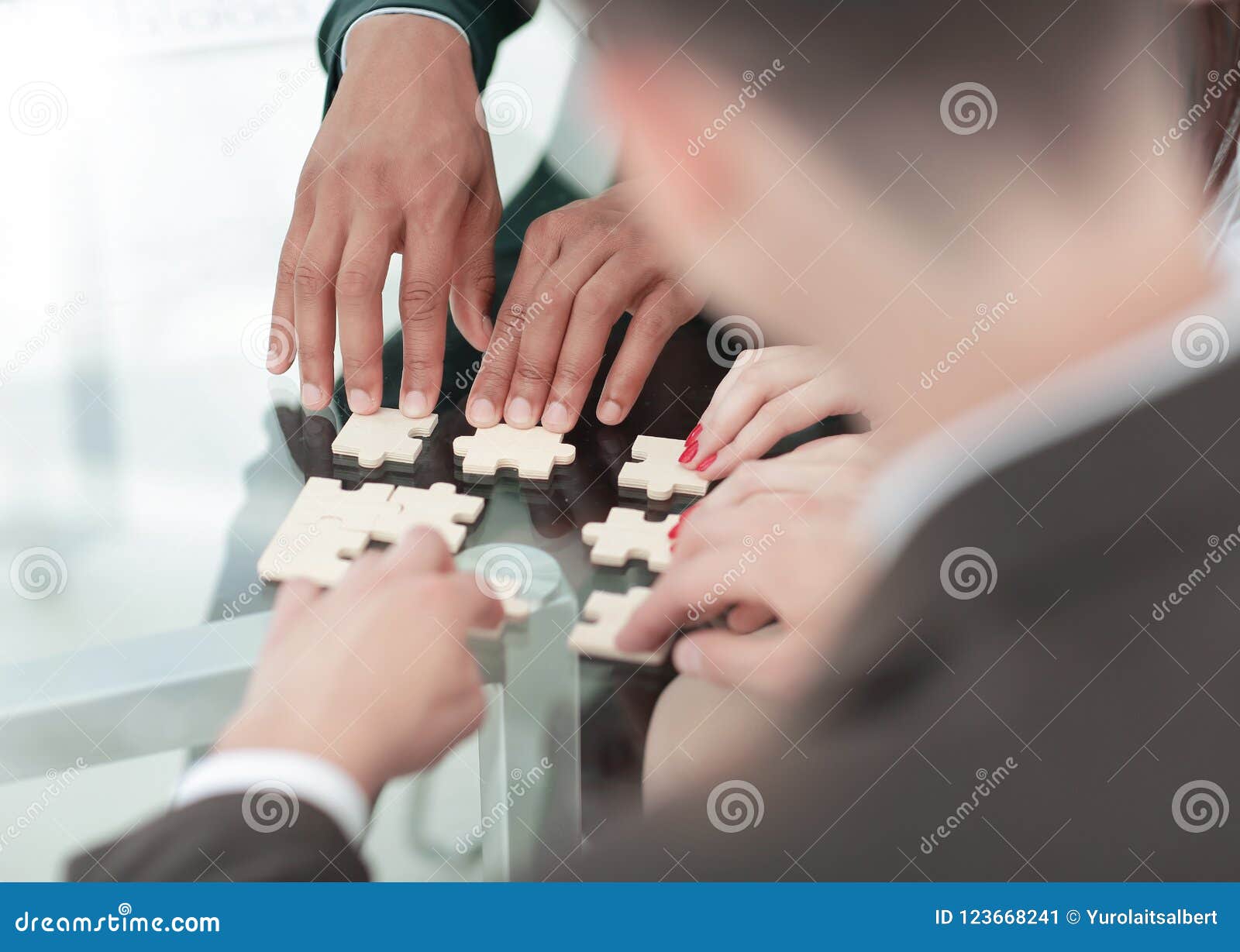 Close Up. Business Team Assembling Puzzle Pieces. Stock Image - Image ... Close Up. Business Team Assembling Puzzle Pieces. Stock Image - Image ...