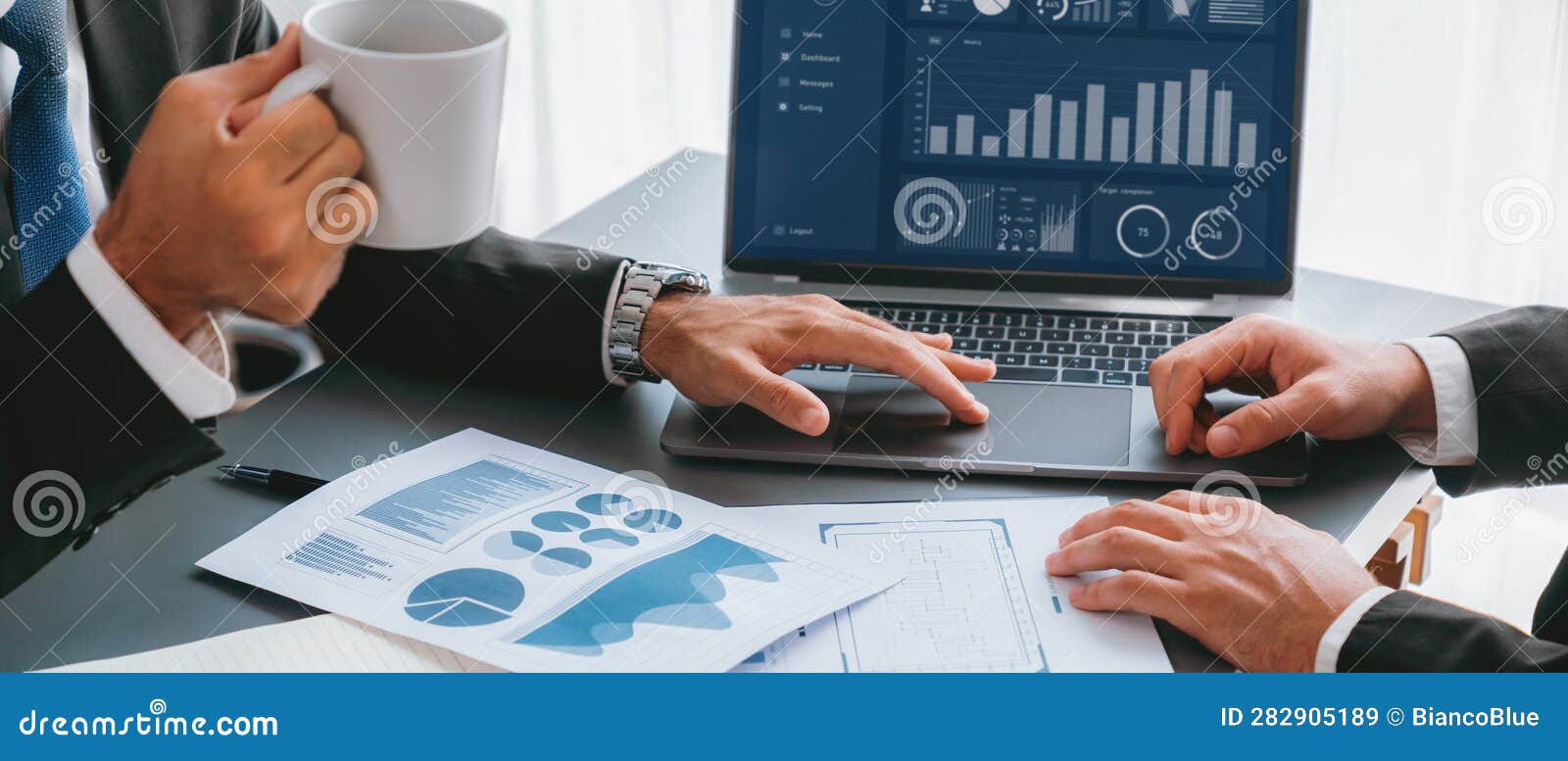 Closeup Busy Analyst Team with Coffee Discuss Financial Data on Laptop ...