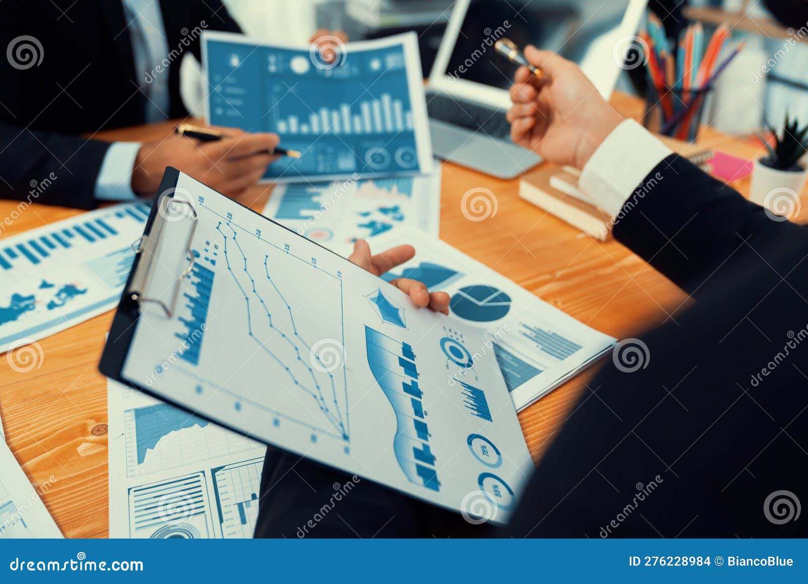 Closeup Busy Analyst Team Discussing Financial Data on Laptop. Fervent ...
