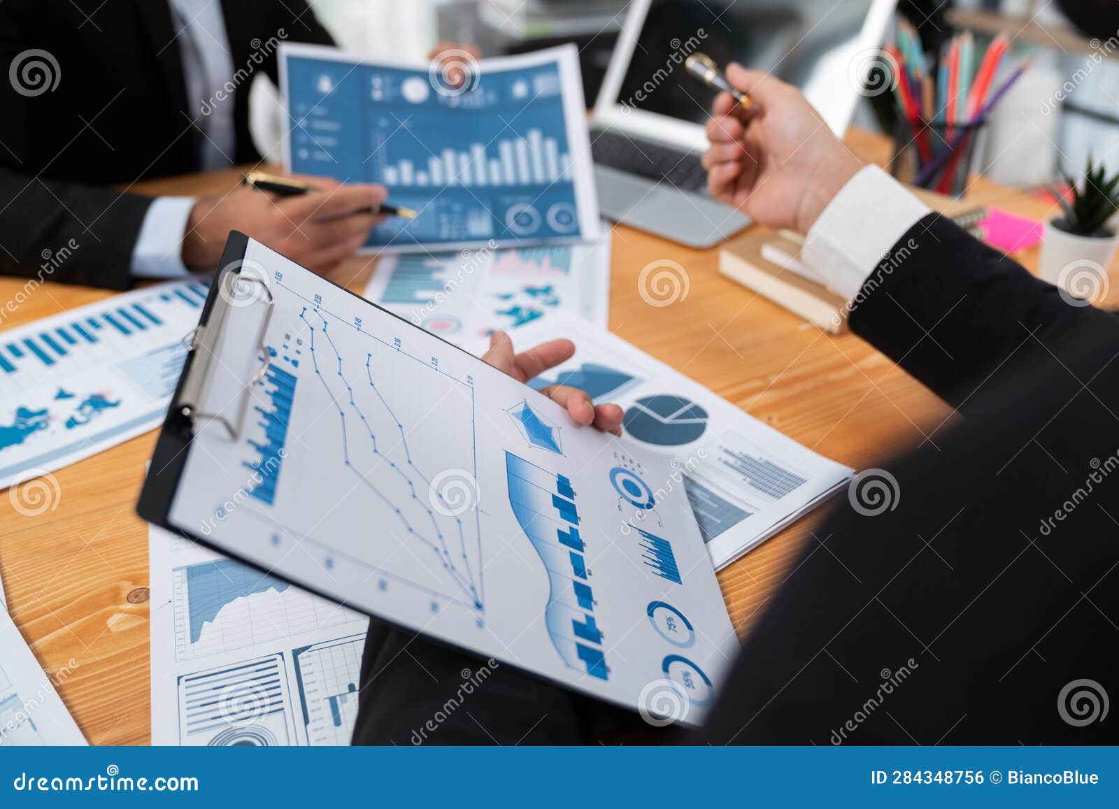 Closeup Busy Analyst Team Discussing Financial Data on Laptop. Fervent ...