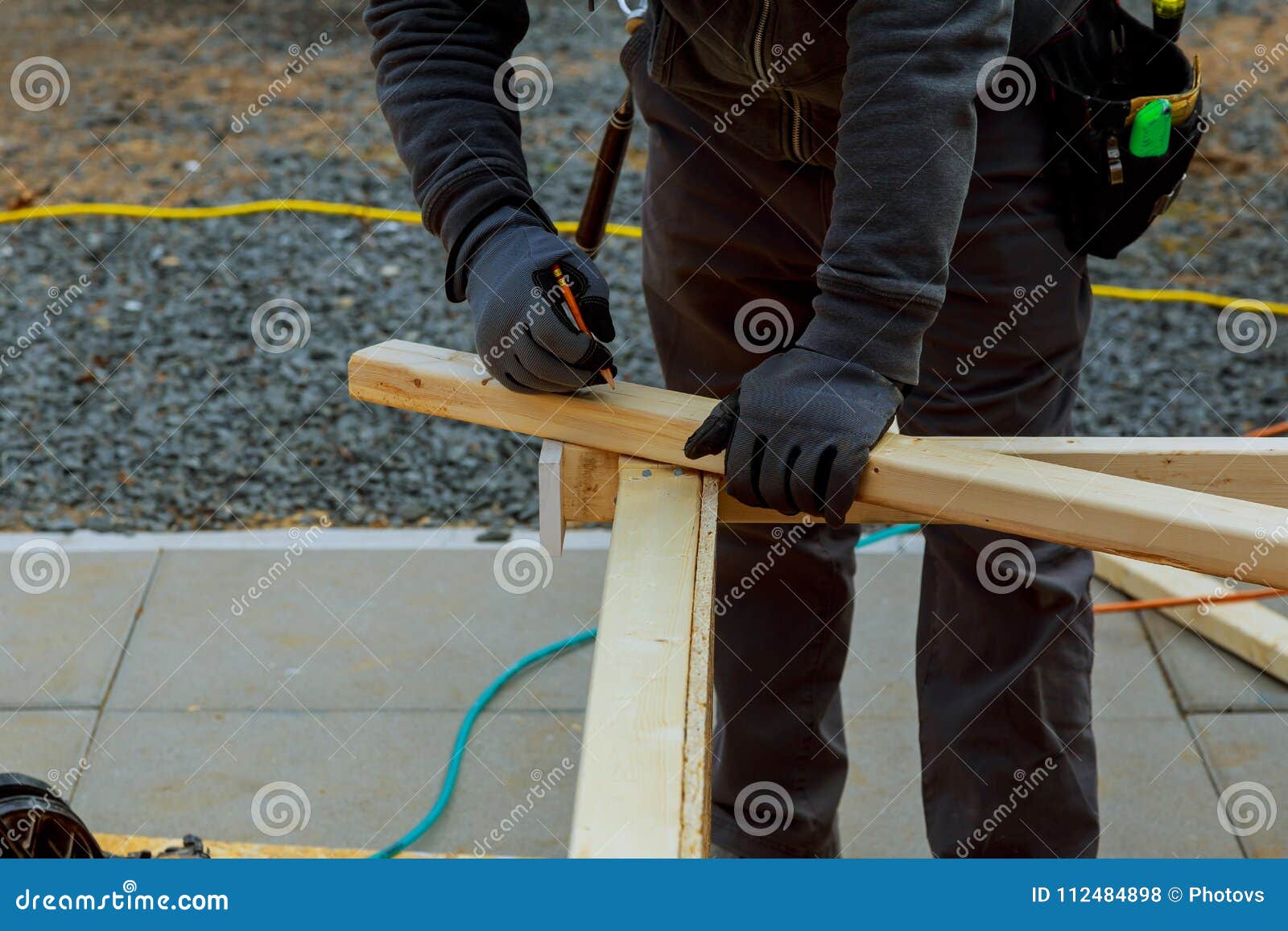 Closeup of a Carpenter Hands Builder at Work with Wooden Construction ...