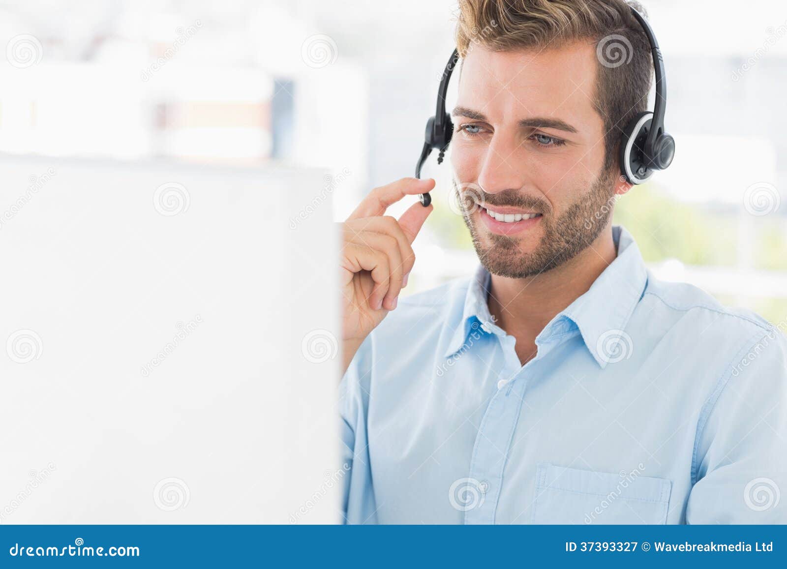 Closeup of a Casual Young Man with Headset Using Computer Stock Image ...