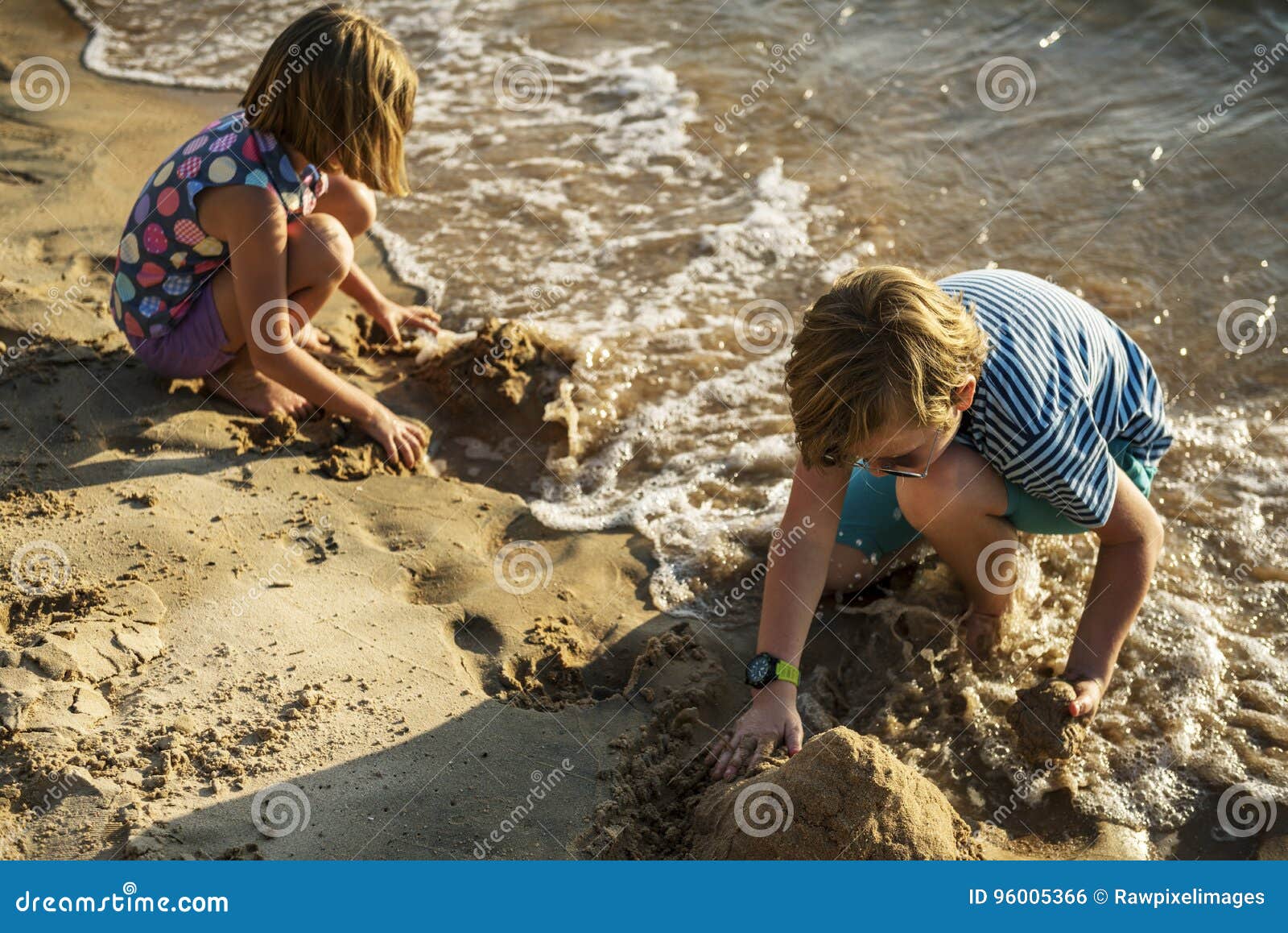Closeup of Caucasian Kids Playing with the Sand Together at the Stock ...