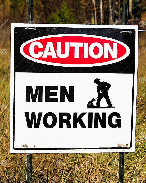 Closeup of a Caution Men Working Sign Stock Photo - Image of industrial ...