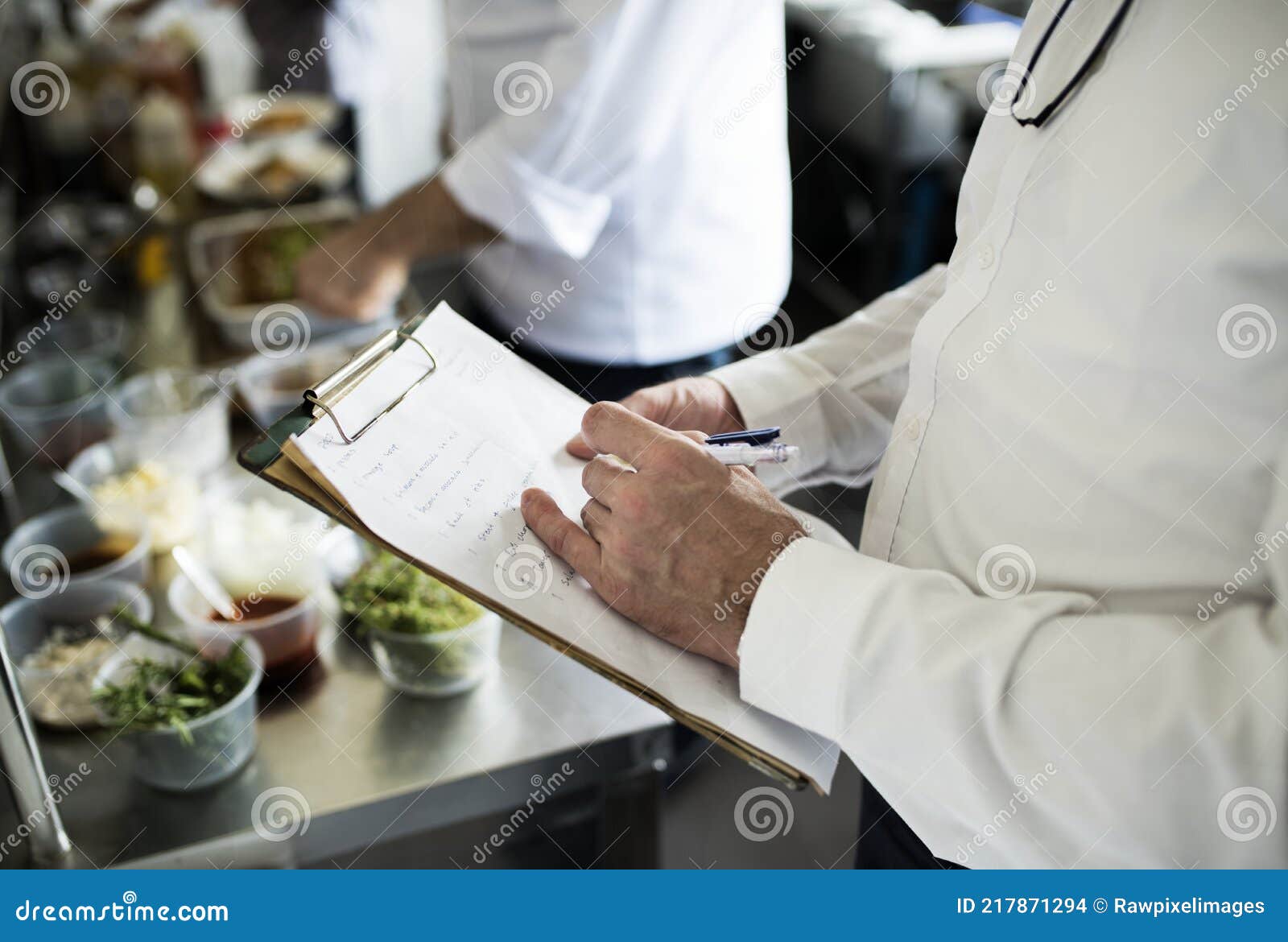 Closeup of Chef Hand Checking Menu List Stock Photo - Image of paper ...
