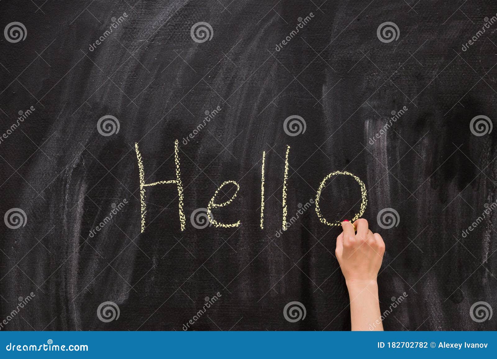 Closeup of Child`s Hand Writing Hello Word with Chalk on the Backboard ...