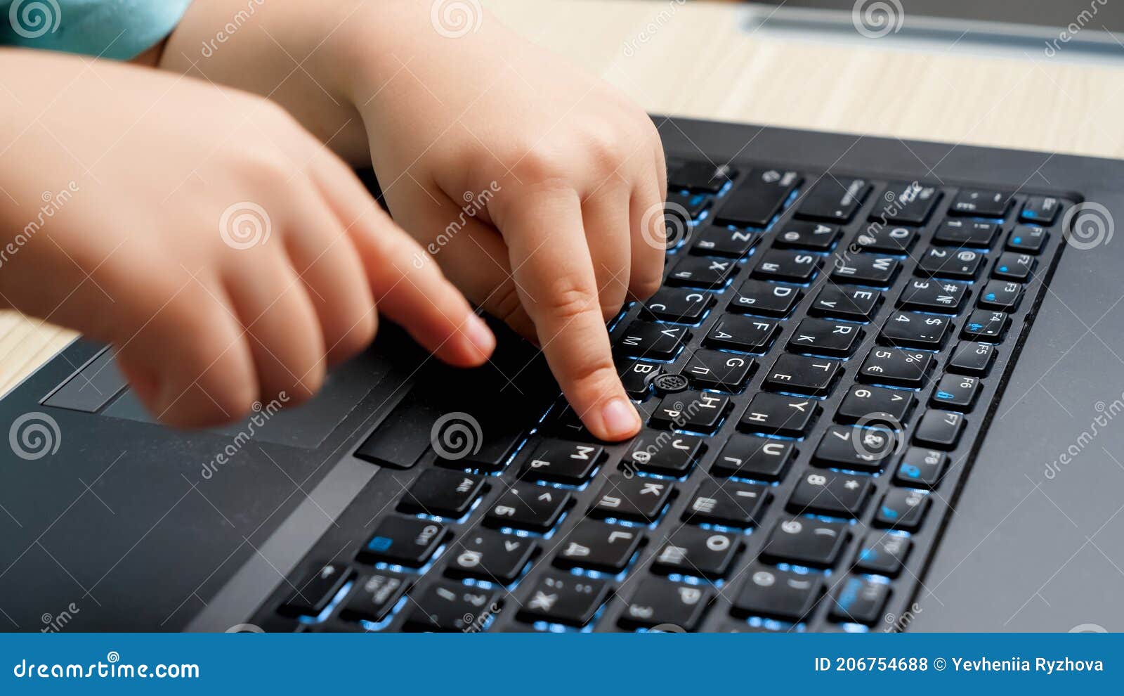 Closeup of Child Typing and Pressing Buttons on Laptop Keyboard. Smart ...