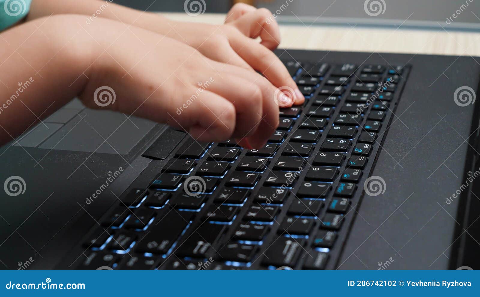 Closeup of Child Typing and Pressing Buttons on Laptop Keyboard. Smart ...