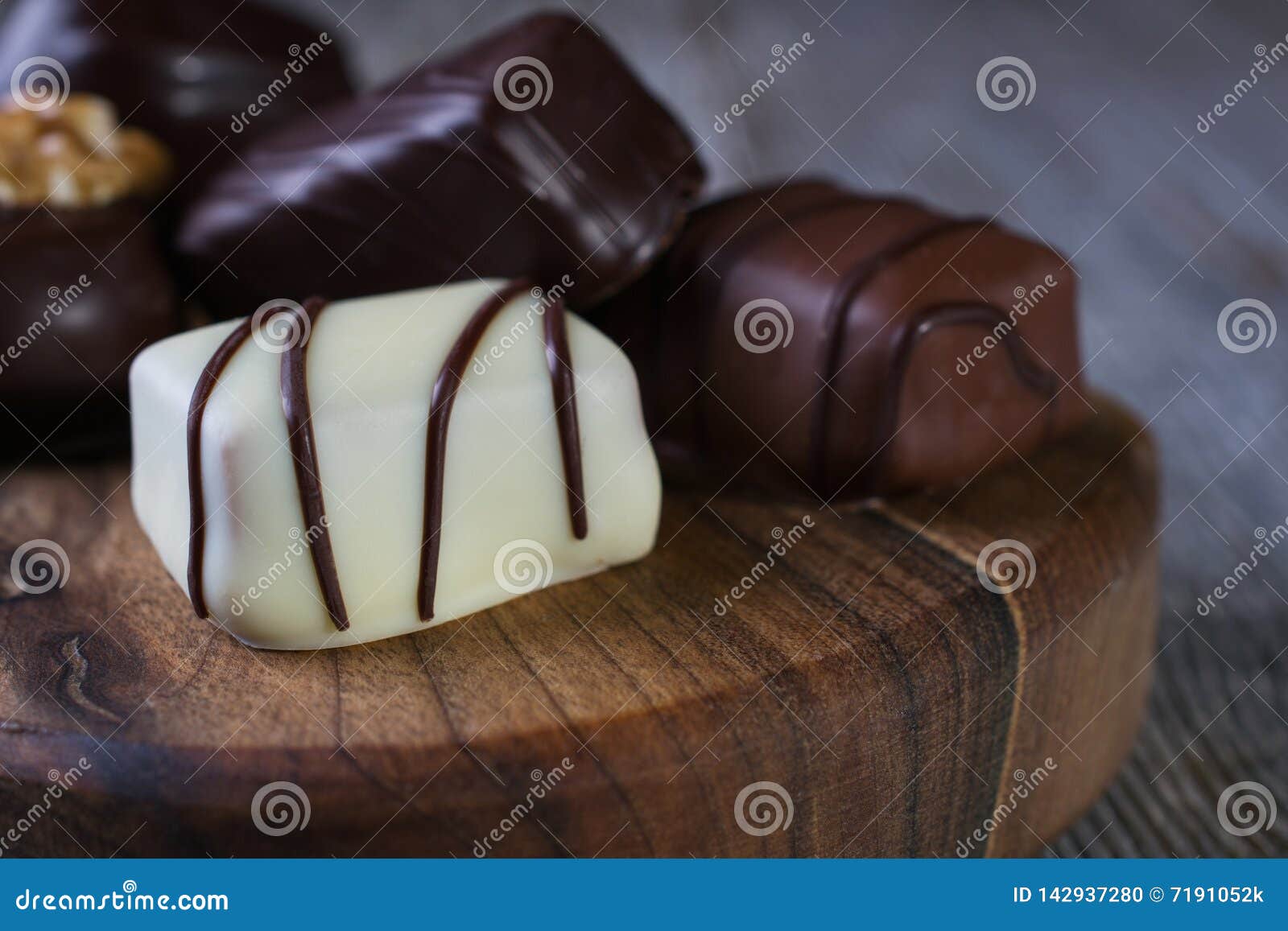 Closeup of Chocolates in Different Shapes and Colors on a Chopping ...