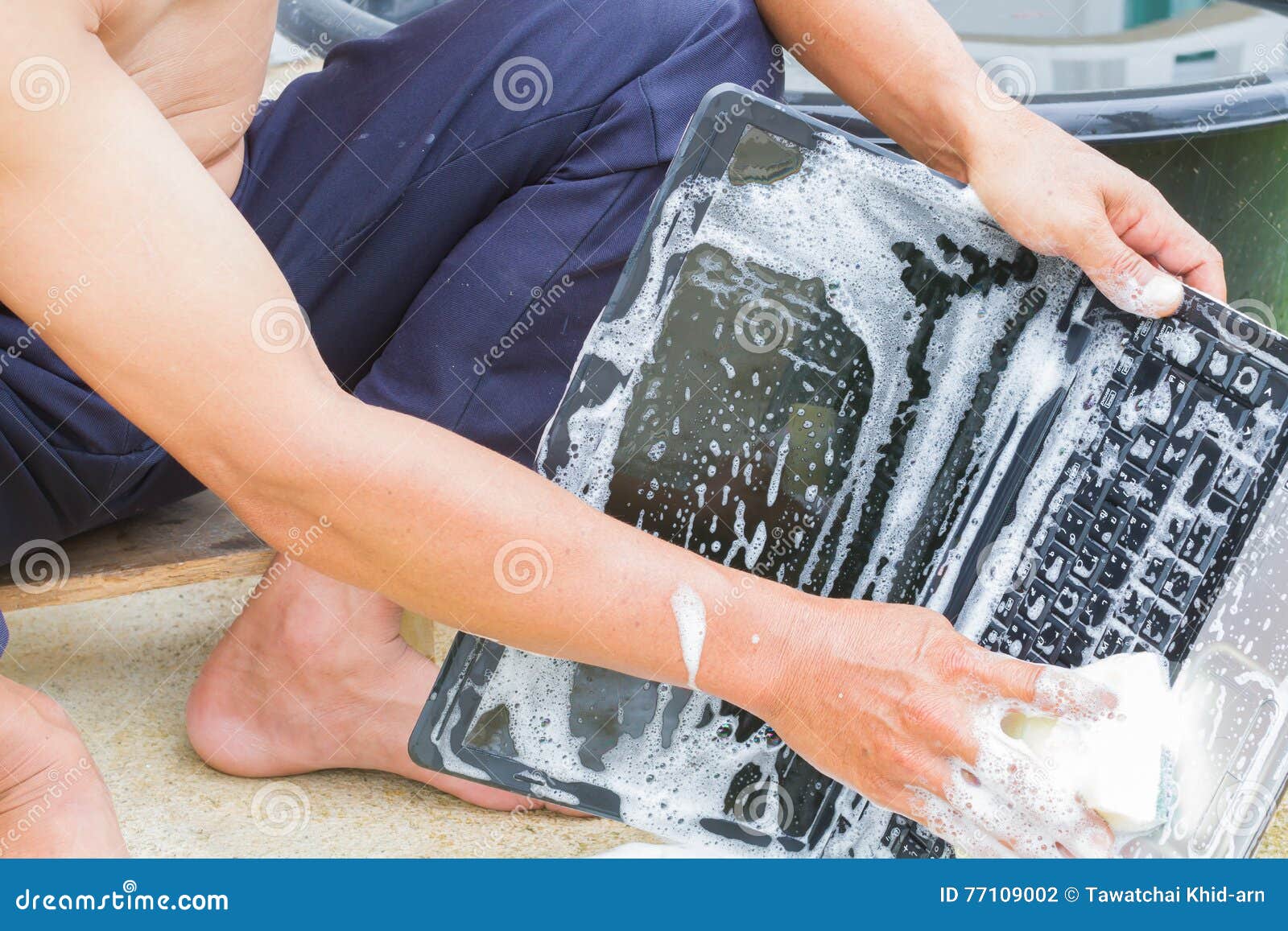 Closeup Cleaning Computer Notebook with Dish Washing Soap, Technology ...