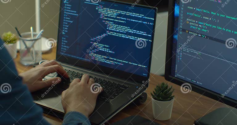 Closeup Coding on Screen, Man Hands Coding Html and Programming on Two Screen Monitors ...