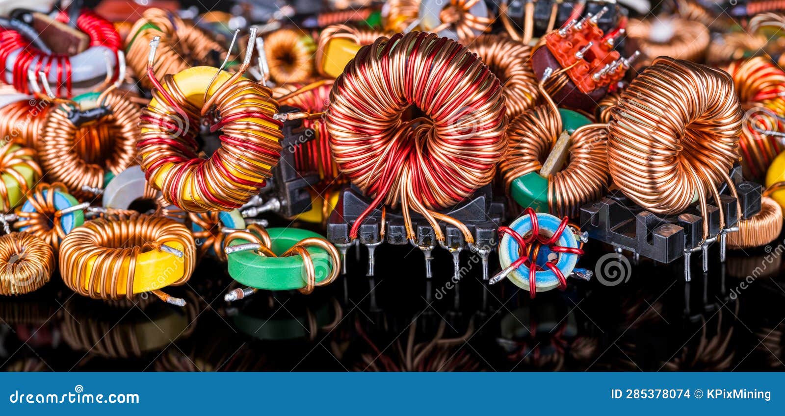 Closeup of Colored Inductors and Transformers with Reflection on a ...