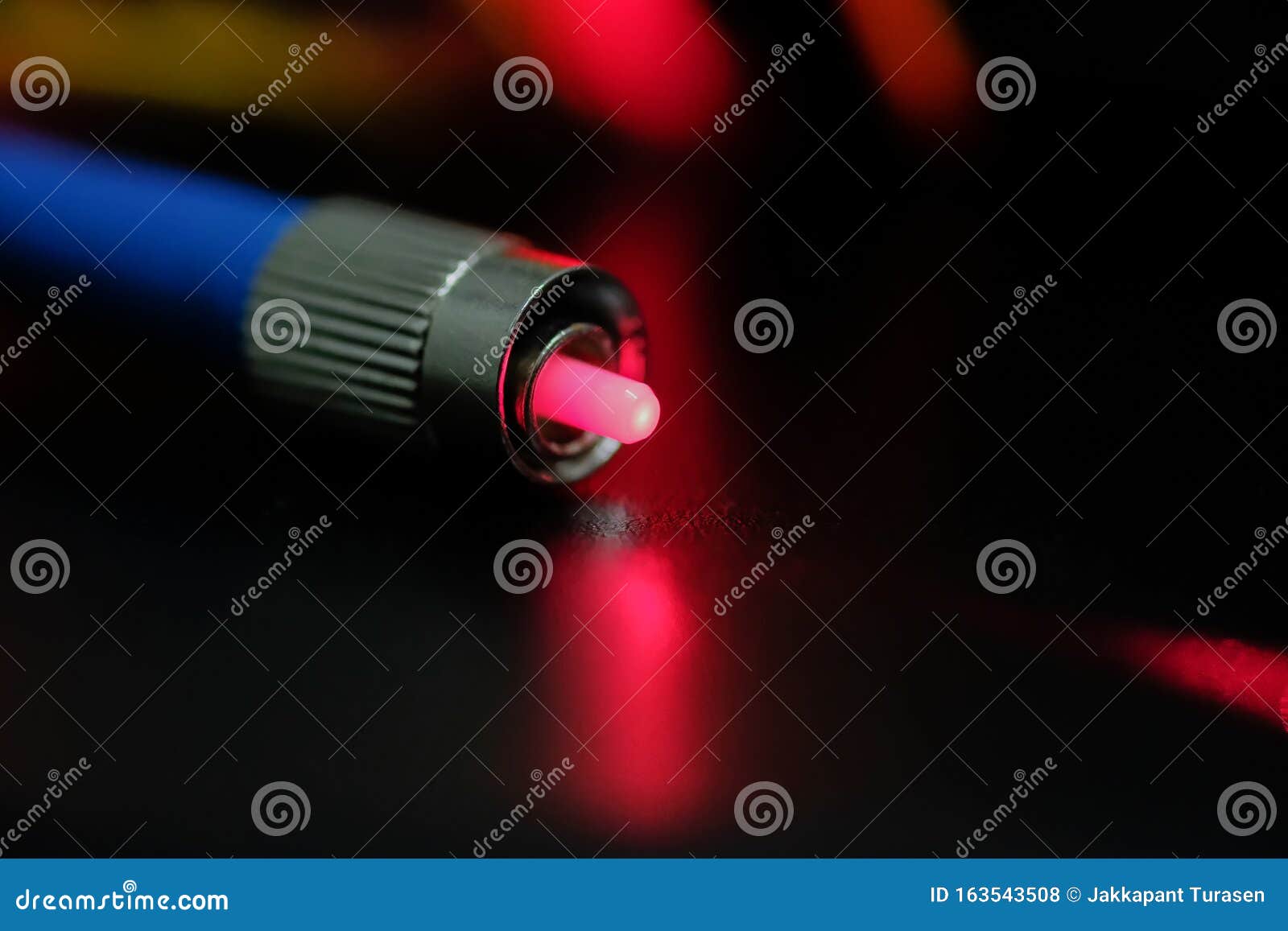 Closeup of Connectors of Optical Fiber Network Cable. the Laser Shines ...