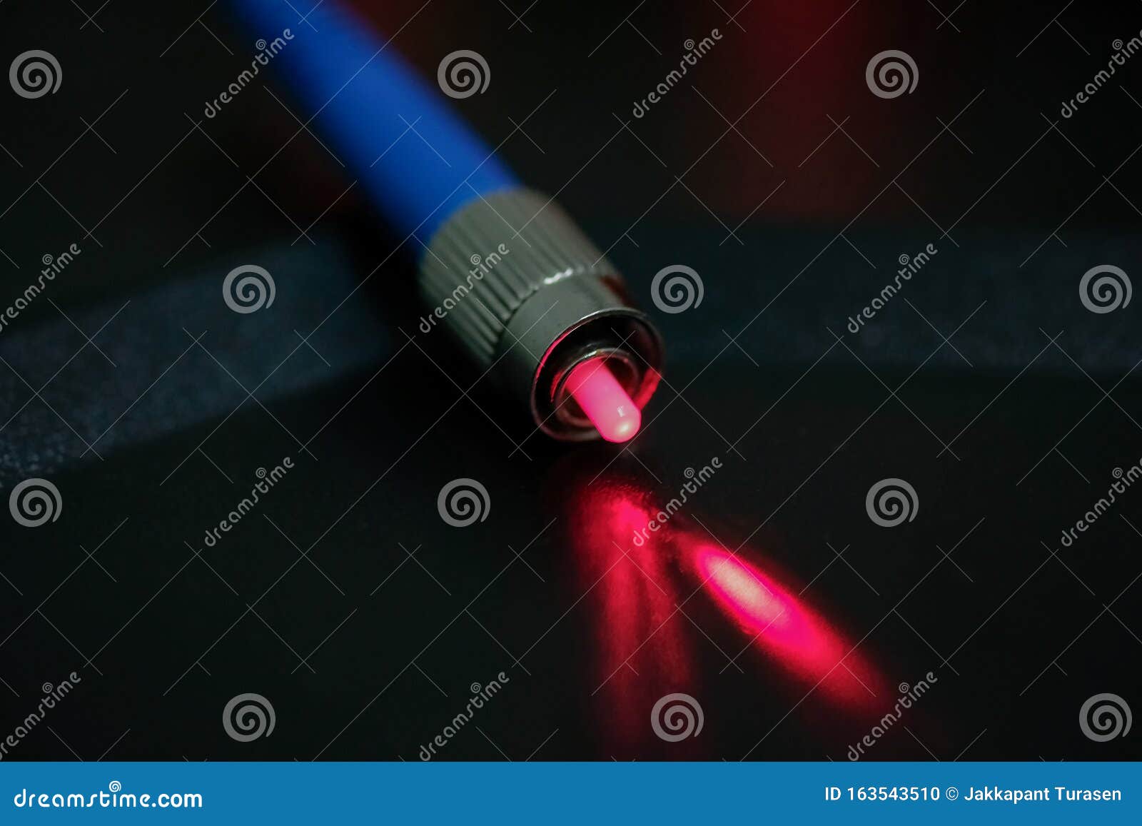 Closeup of Connectors of Optical Fiber Network Cable. the Laser Shines ...
