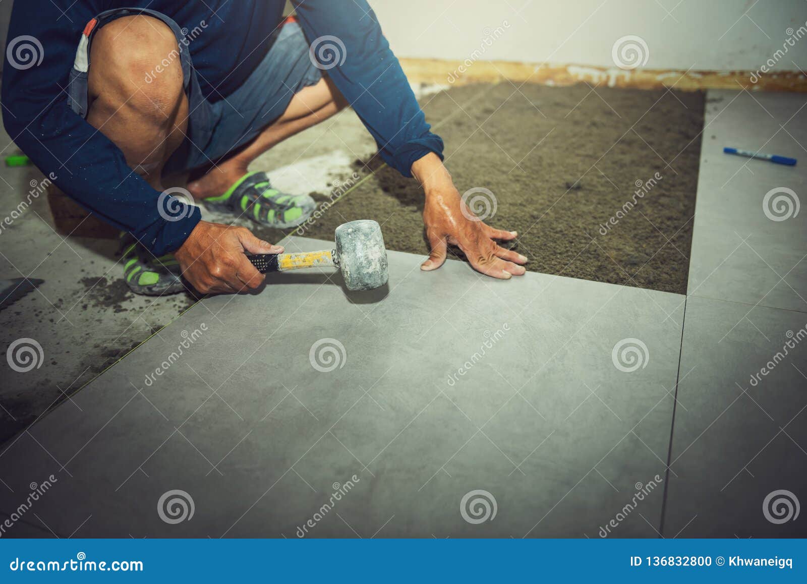 Installing The Tiles In The Form Of Brick On The Wall Using Plastic ...