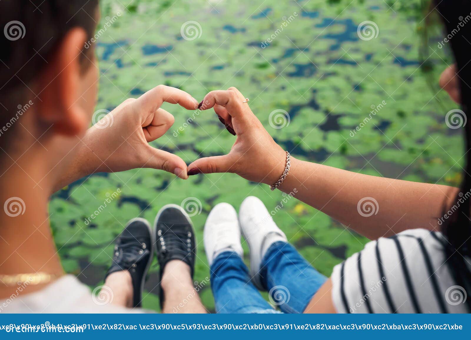 Closeup of Couple Making Heart Shape with Hands Stock Photo - Image of ...