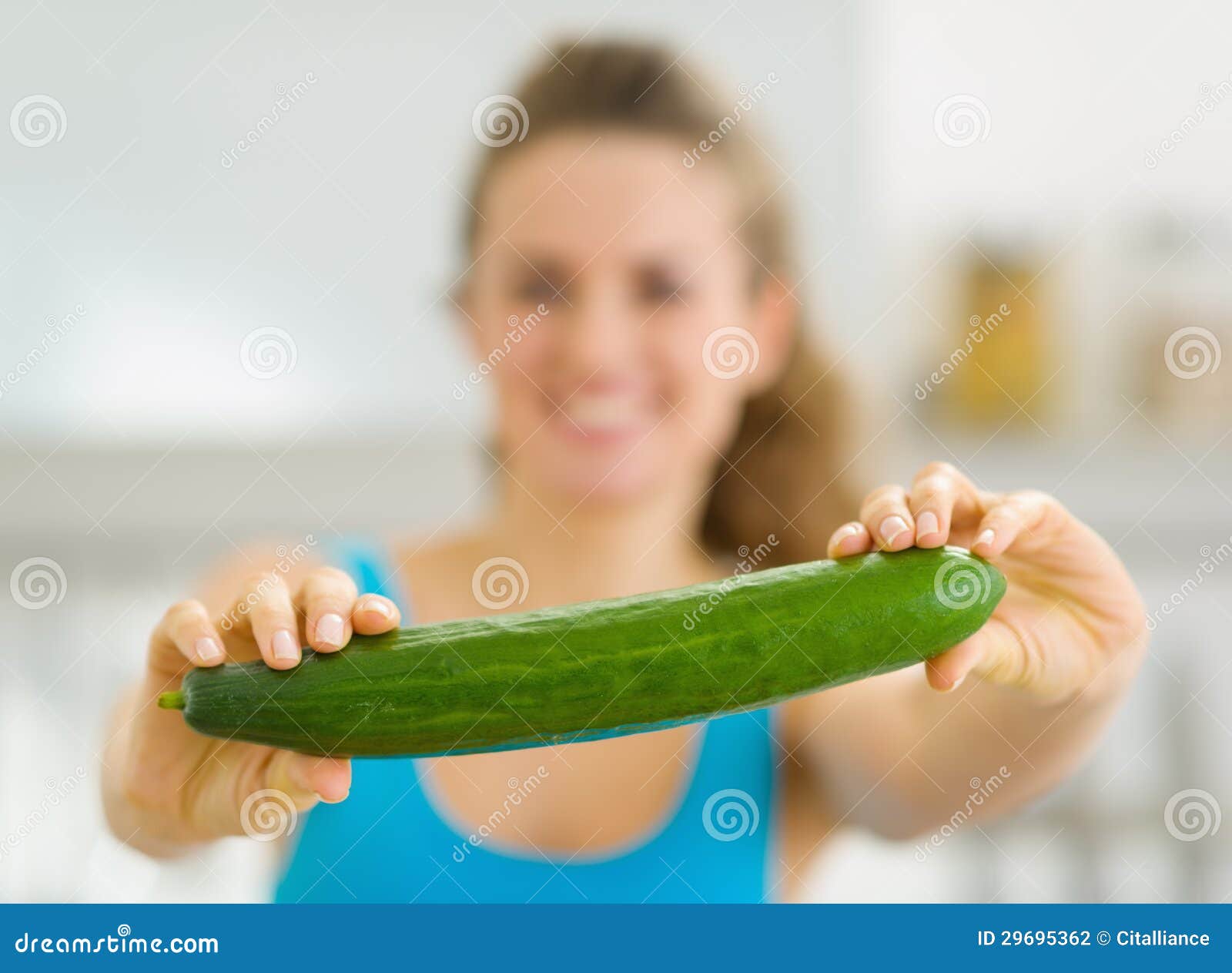 Closeup on Cucumber in Hand of Young Woman Stock Photo - Image of ...