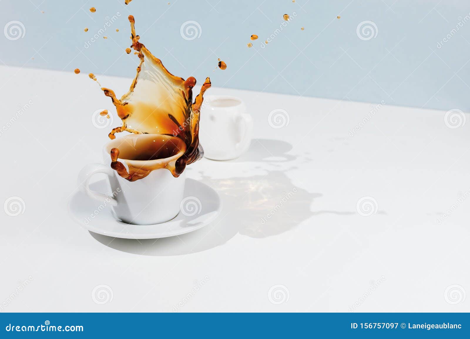 Closeup of Cup with Splashing Coffee, Saucer and Creamer Stock Image ...