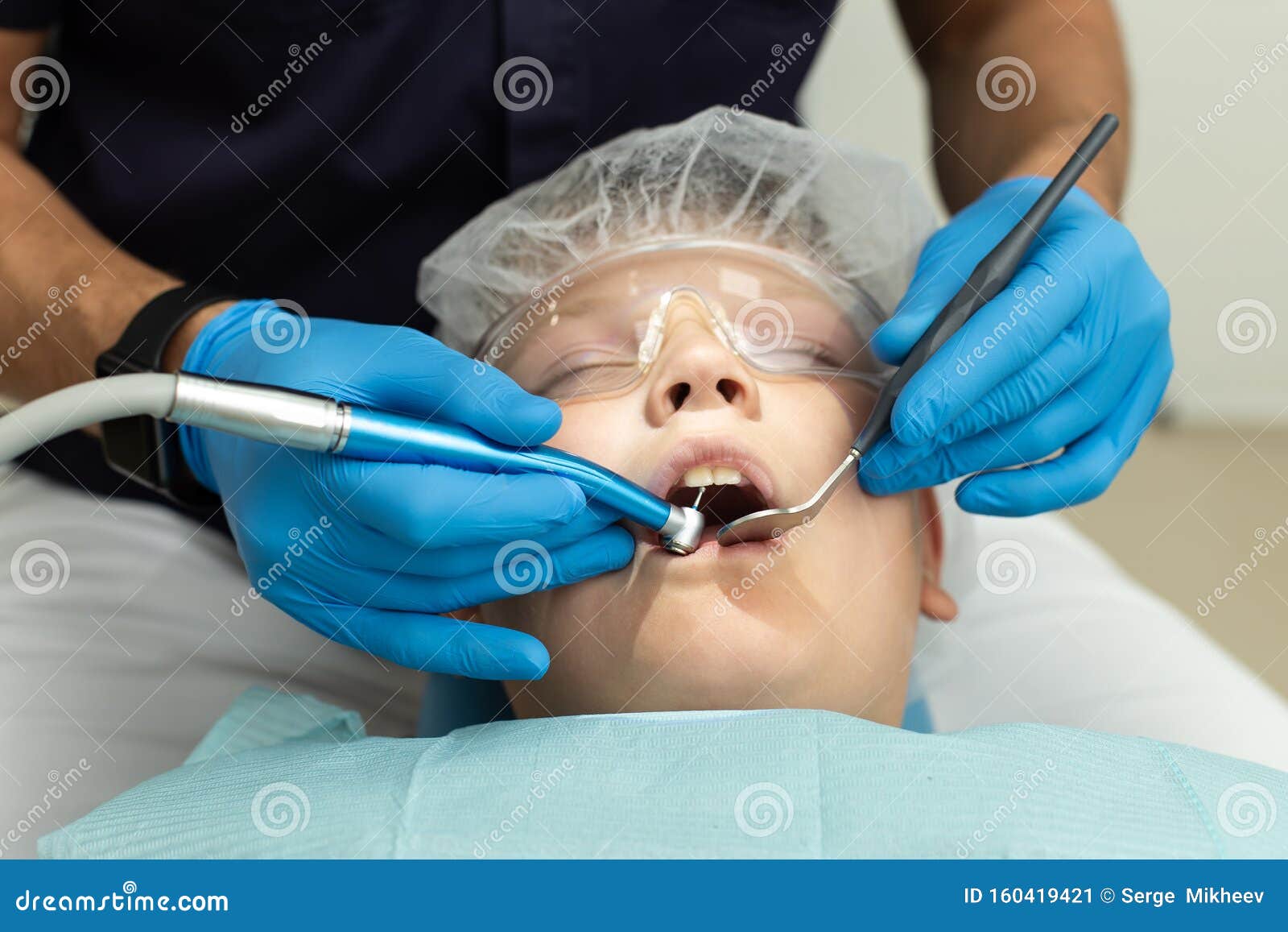 Closeup of Dentist Operation Over Young Boy`s Teeths Stock Image ...