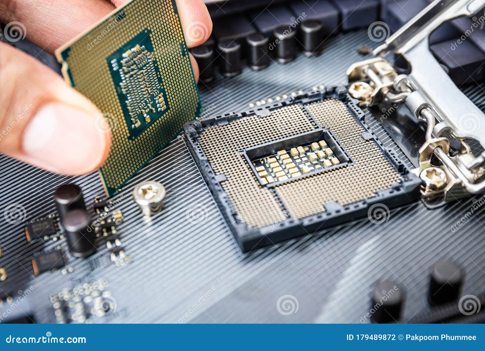 Closeup Detail Of CPU Chip Over Socket With Hand Of A Modern Computer ...