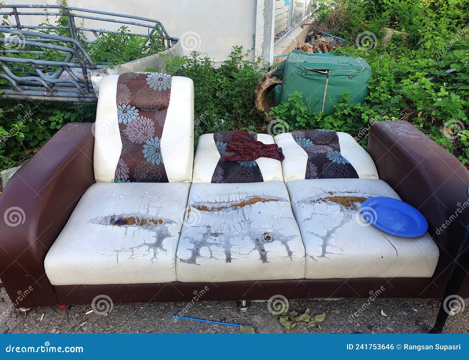 Dirty Old Colorful Sofa is Left with Garbage on the Side of the Road ...