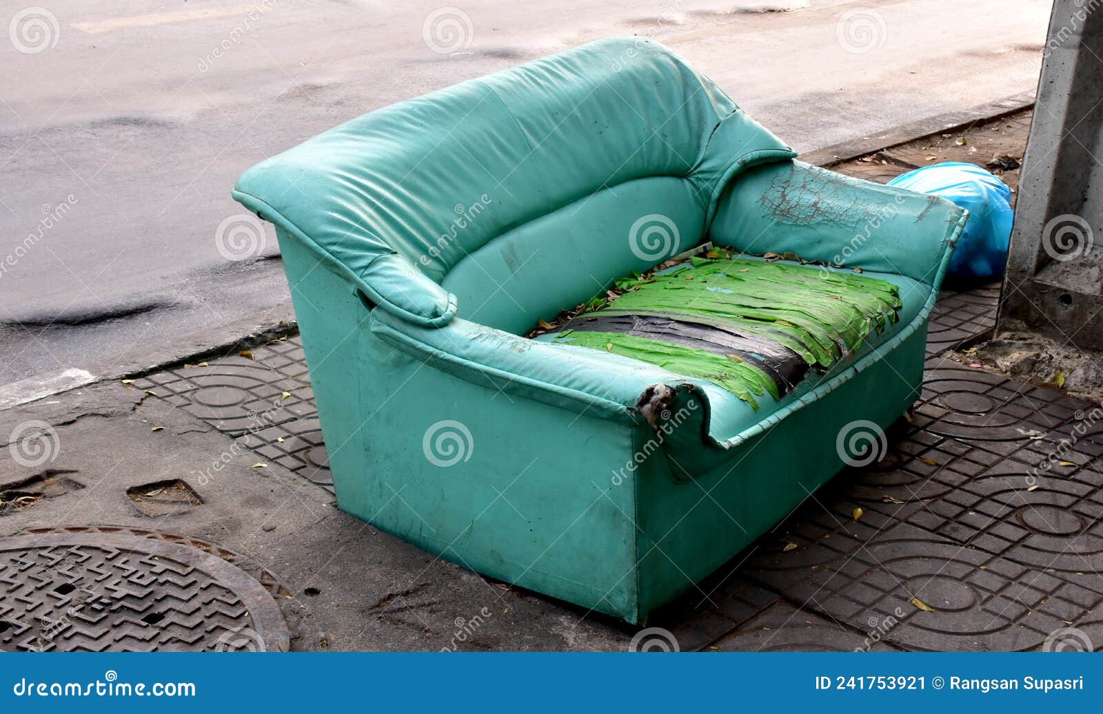 Dirty Old Colorful Sofa is Left with Garbage on the Side of the Road ...