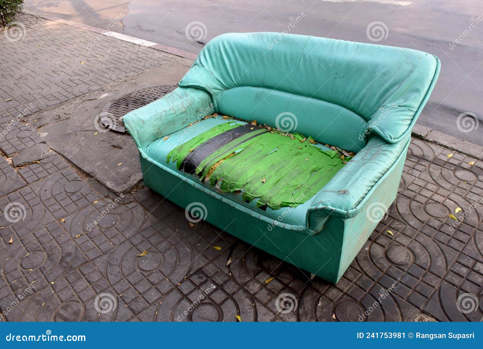 Dirty Old Colorful Sofa is Left with Garbage on the Side of the Road ...
