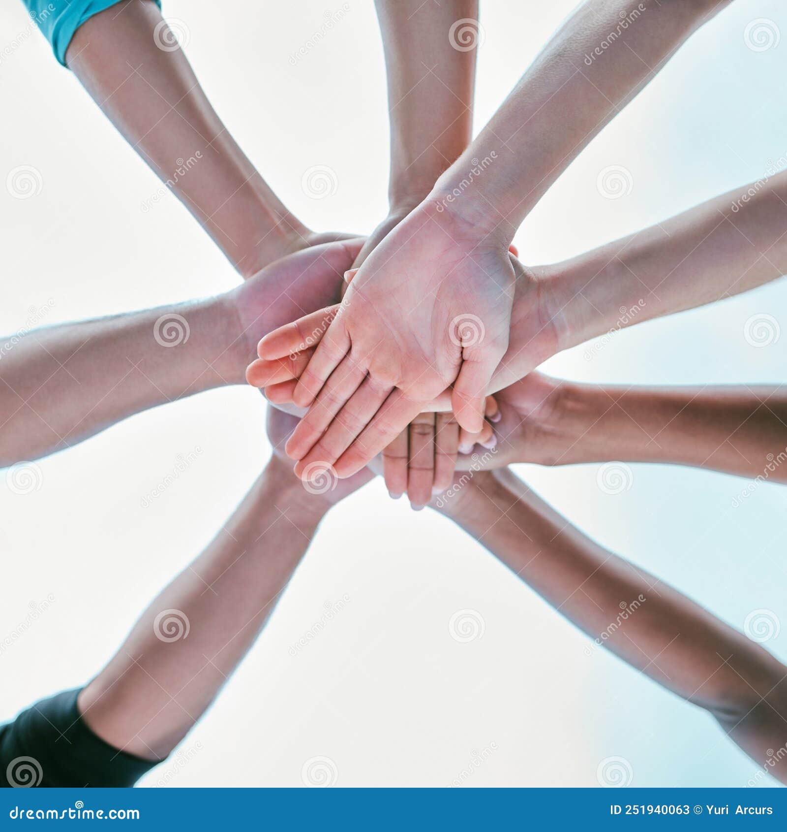 Closeup of Diverse Group of People from Below Stacking Hands Together ...