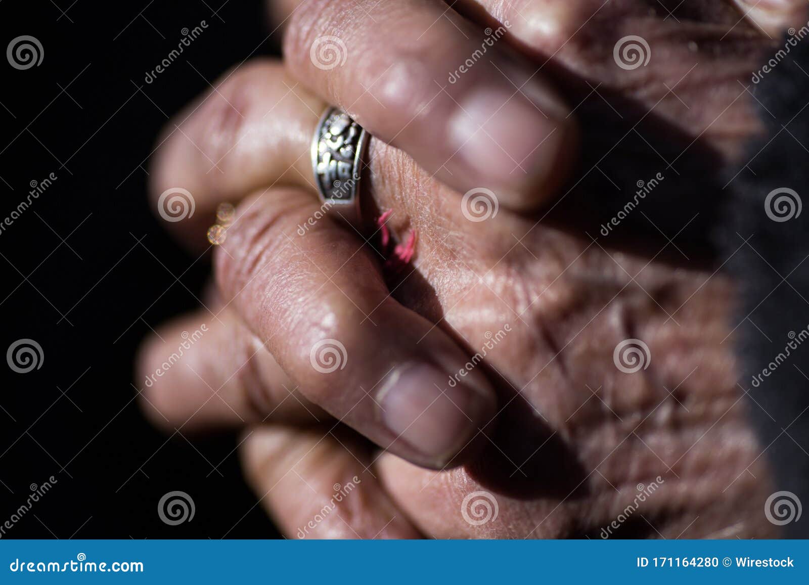 Closeup of an Elderly Couple Holding Hands with a Symbolic Ring Stock ...