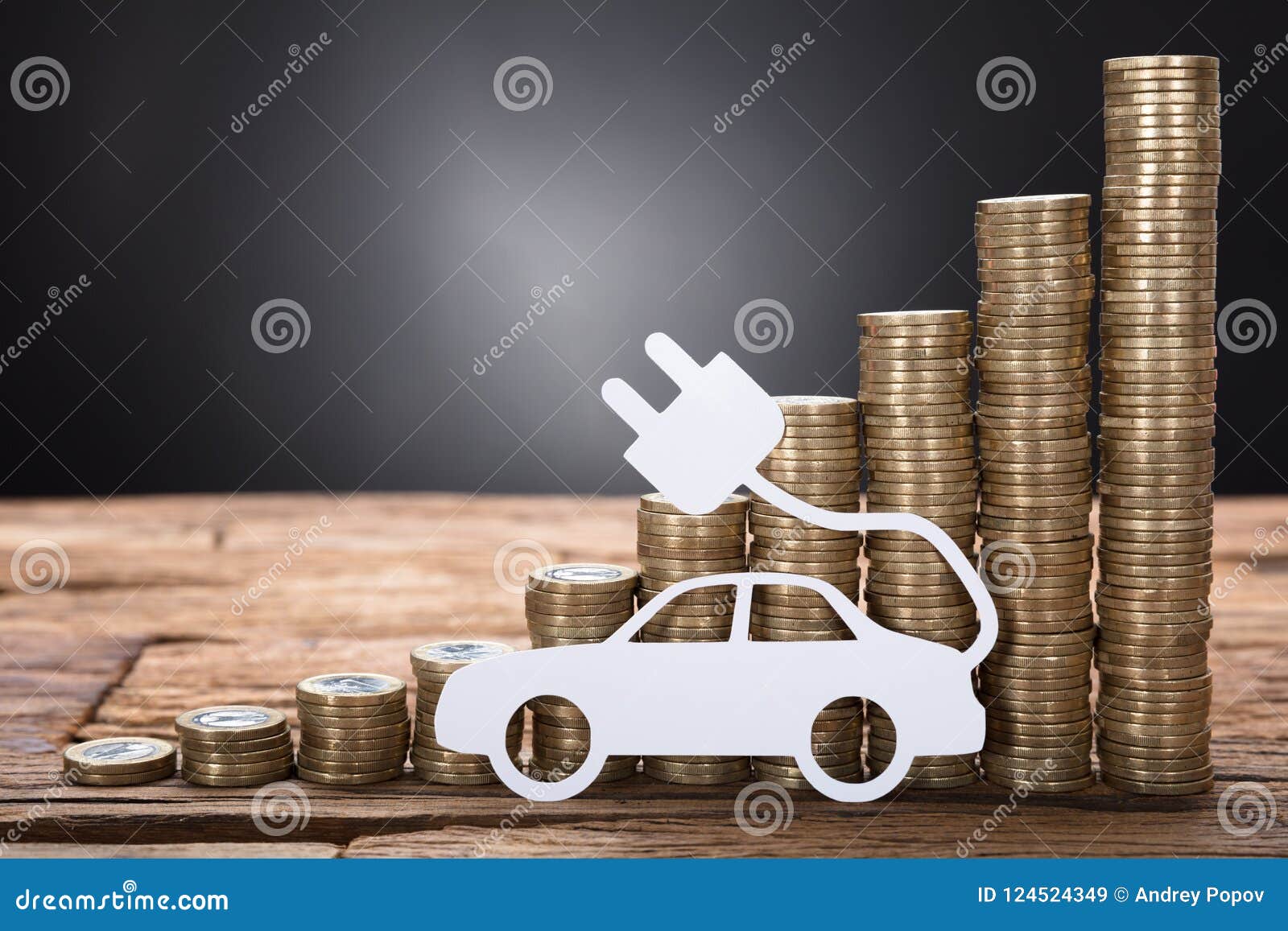 Electric Car Against Stacked Coins on Wooden Table Stock Image - Image ... Electric Car Against Stacked Coins on Wooden Table Stock Image - Image ...