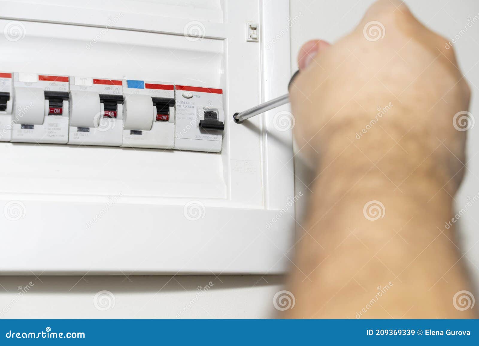 A Closeup of an Electrical Engineer Working in a Power Electrical Panel ...