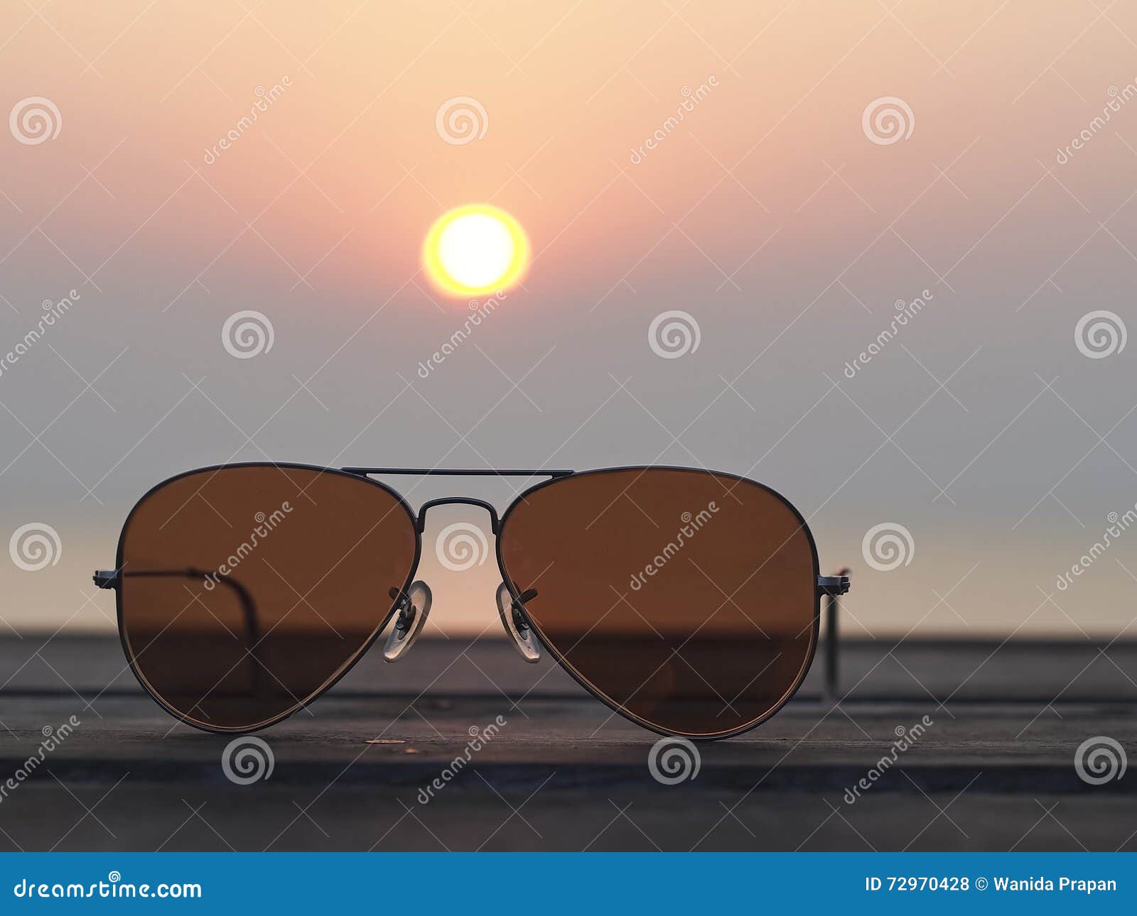 Closeup on Eyeglasses with Focused and Blurred Landscape Sunset View ...