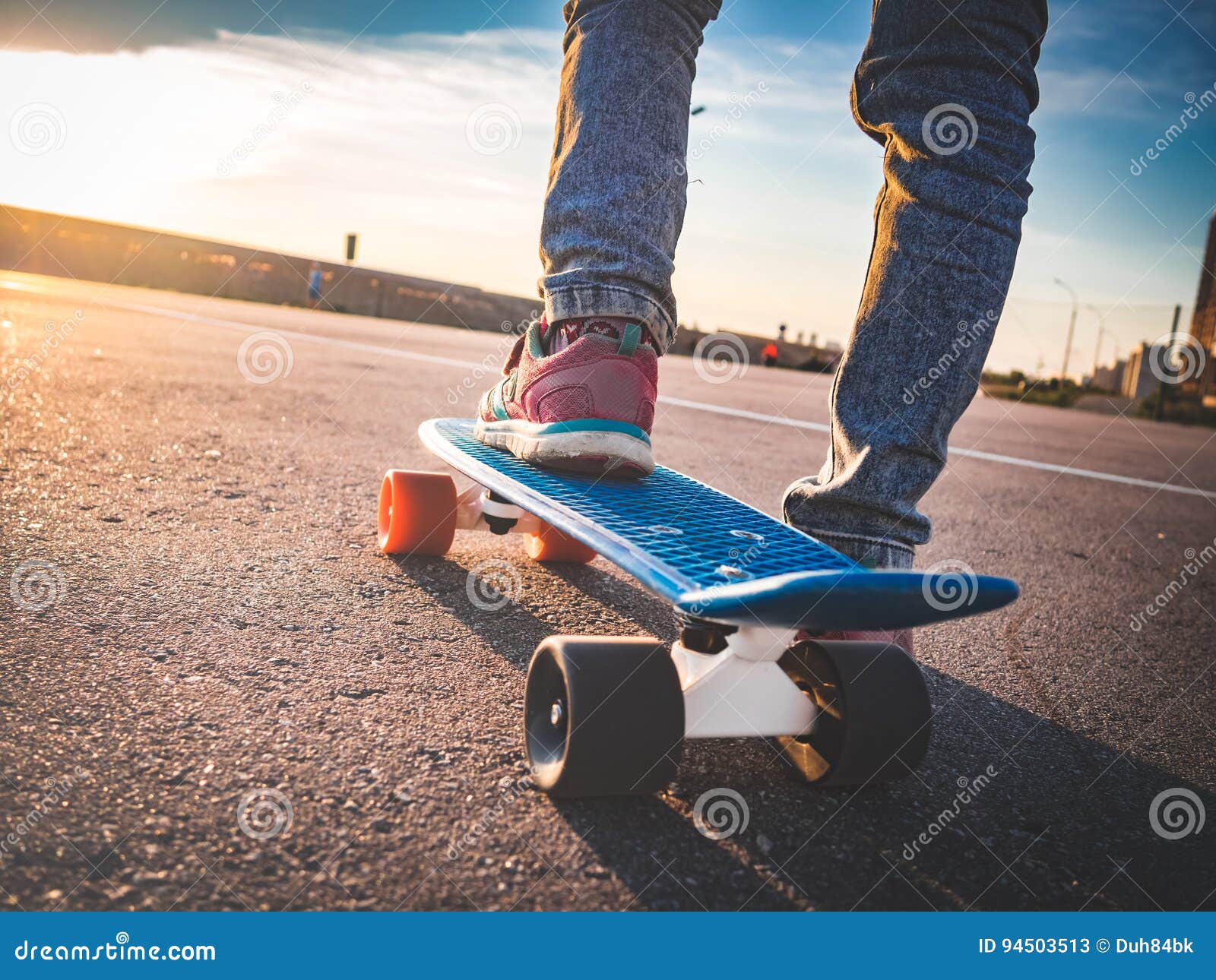 Closeup of the Feet on the Skateboard on the Pavement Stock Image ...