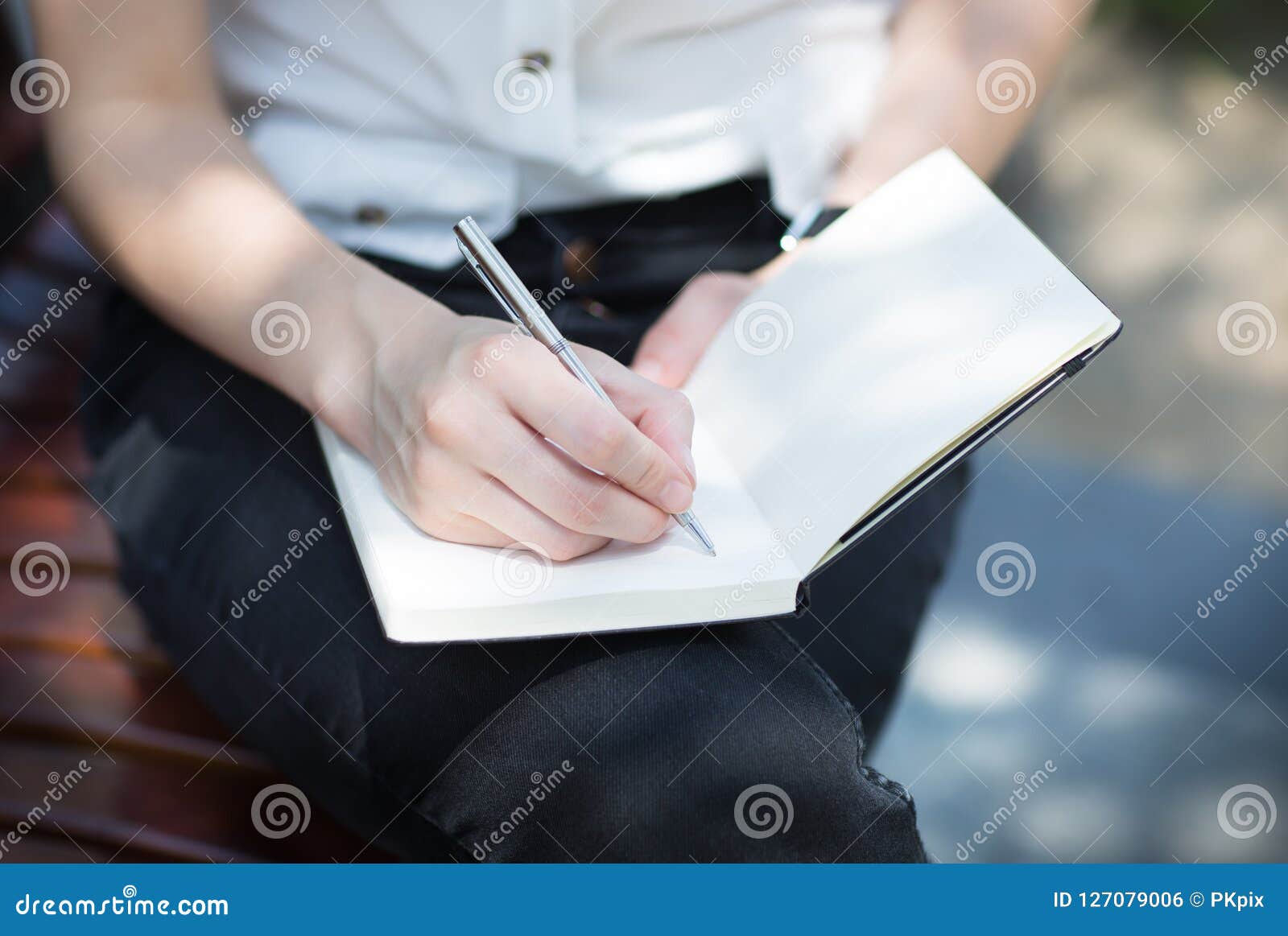 Closeup of a Female Hand Writing on an Blank Notebook with a Pen. Stock ...