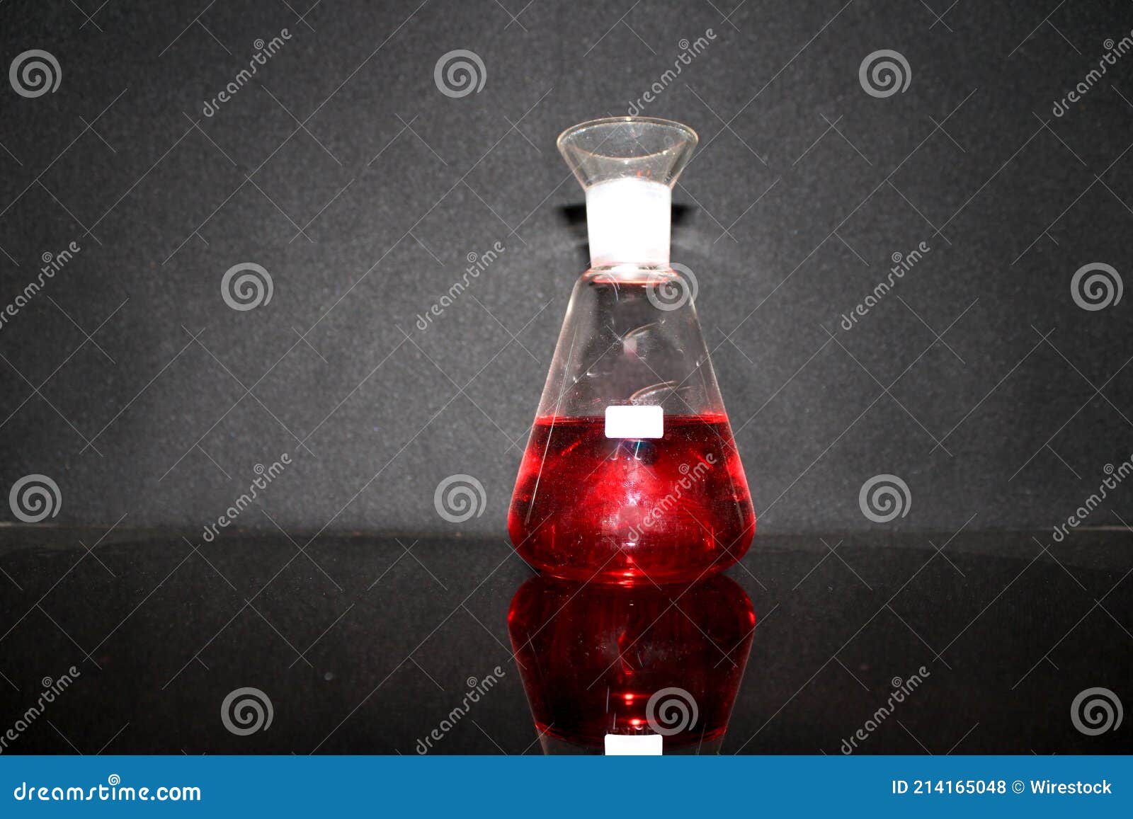 Closeup of a Flask with Red Liquid on a Black Background Stock Photo ...
