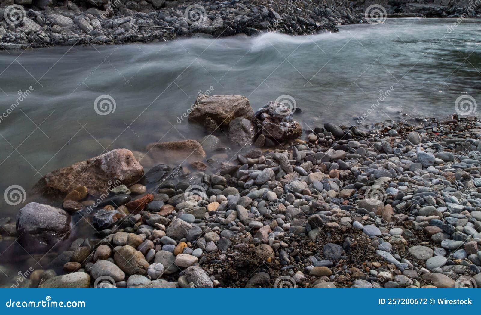 Closeup of a Flowing River Surrounded by Rocks Stock Photo - Image of ...