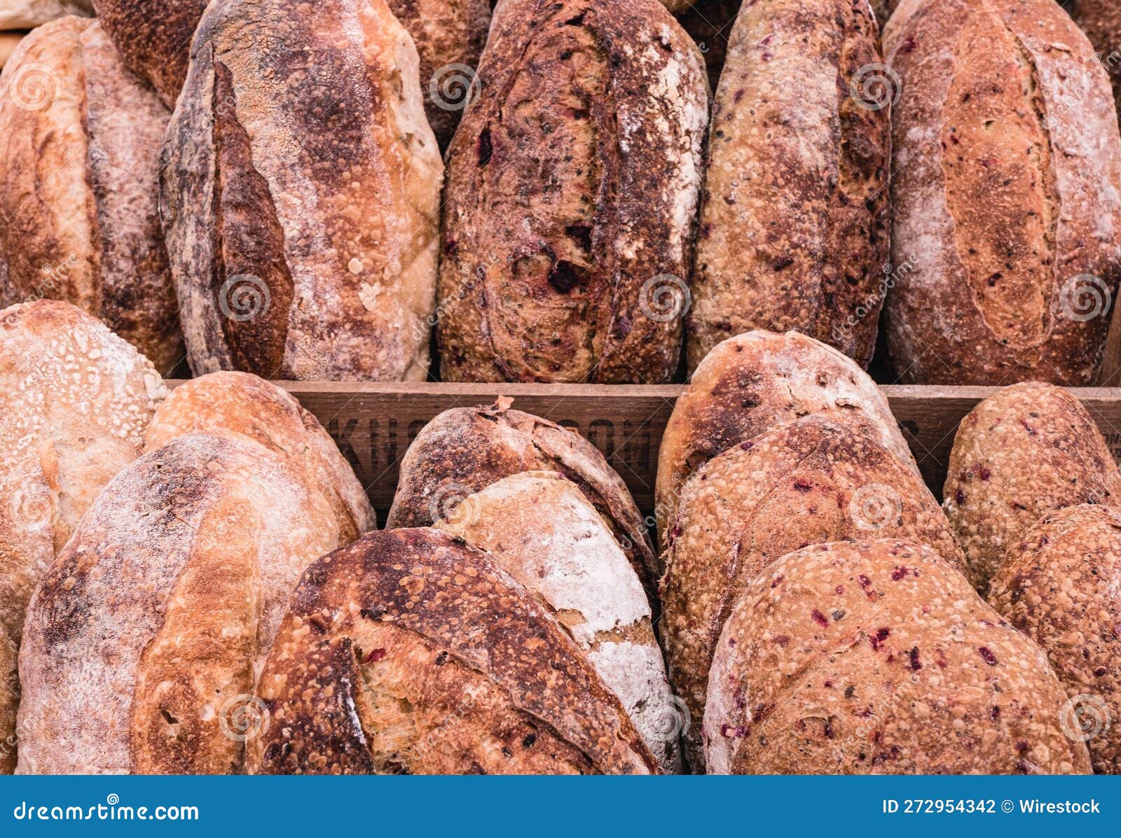 Closeup of Fresh Loaves of Bread on the Racks of a Market Stock Photo ...