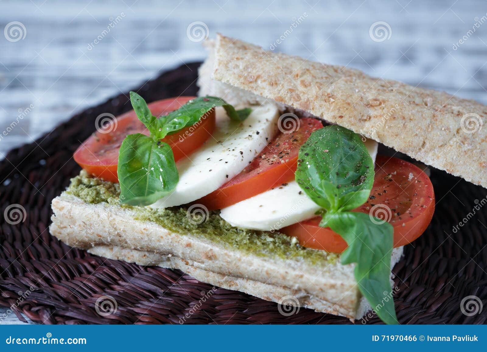 Closeup of a Fresh Sandwich with Mozzarella, Tomatoes, Pesto and Stock ...