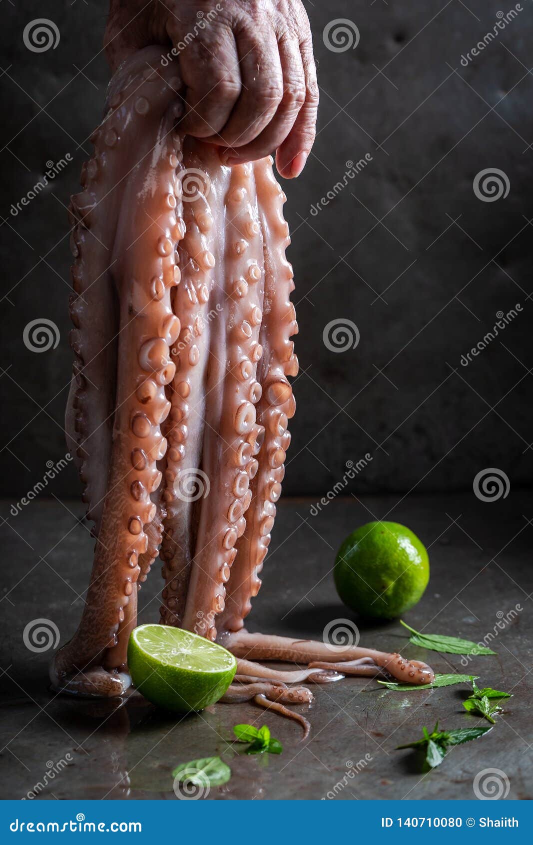 Freshly Caught Octopus Holding in Hand and Lime Stock Photo - Image of ...