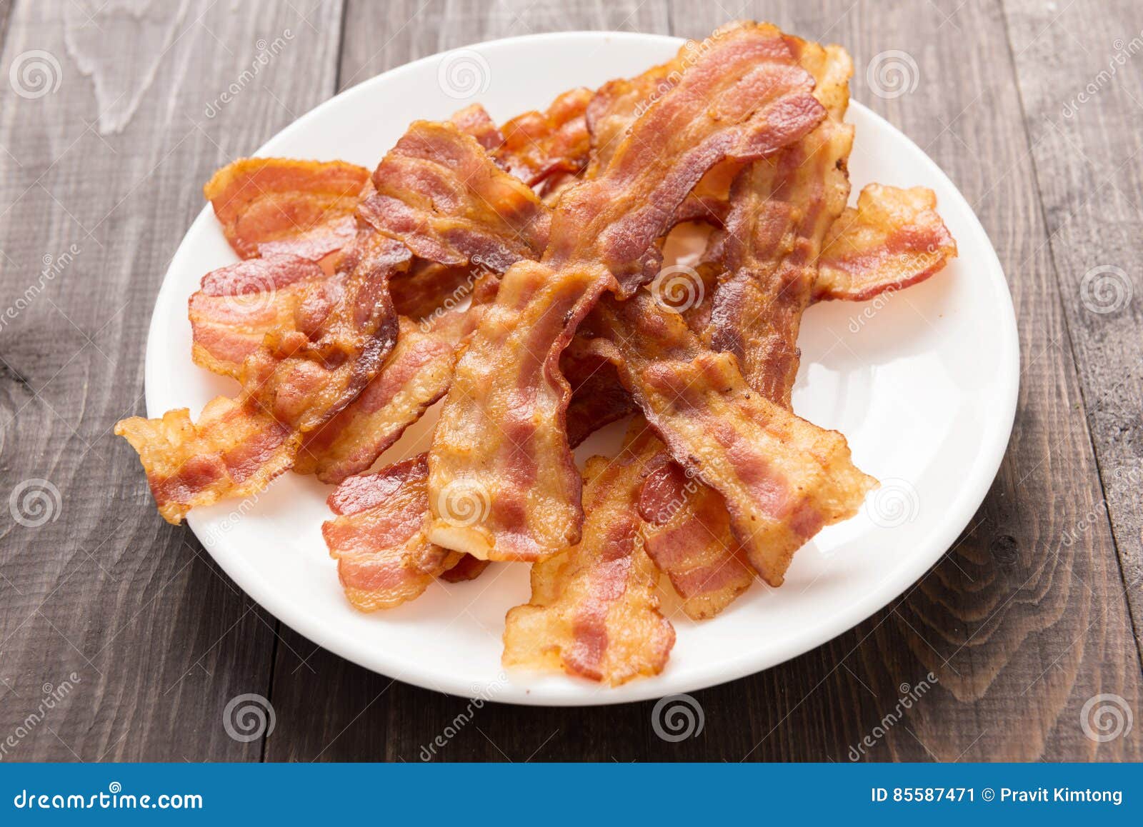 Closeup of Fried Bacon Strips on White Plate Stock Image - Image of ...